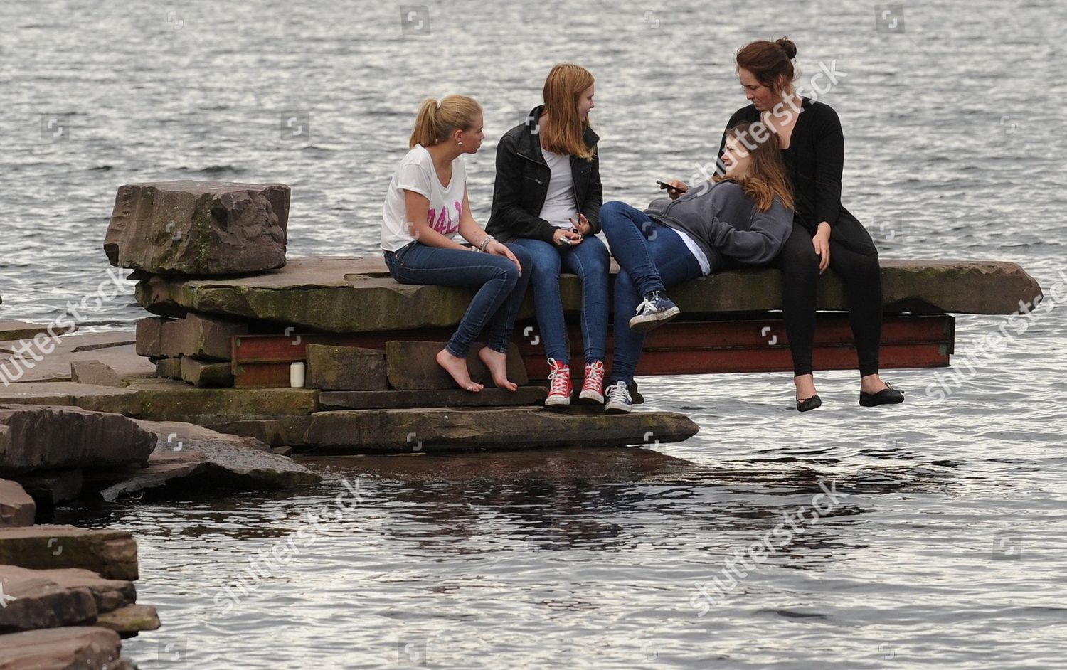 Four Girls Sitting On Rock Opposite Editorial Stock Photo - Stock Image ...