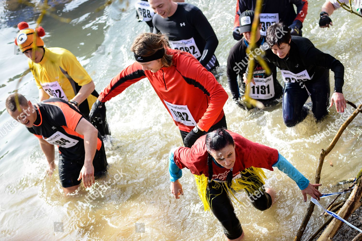 Participants Wade Through Water Obstacle On Editorial Stock Photo ...