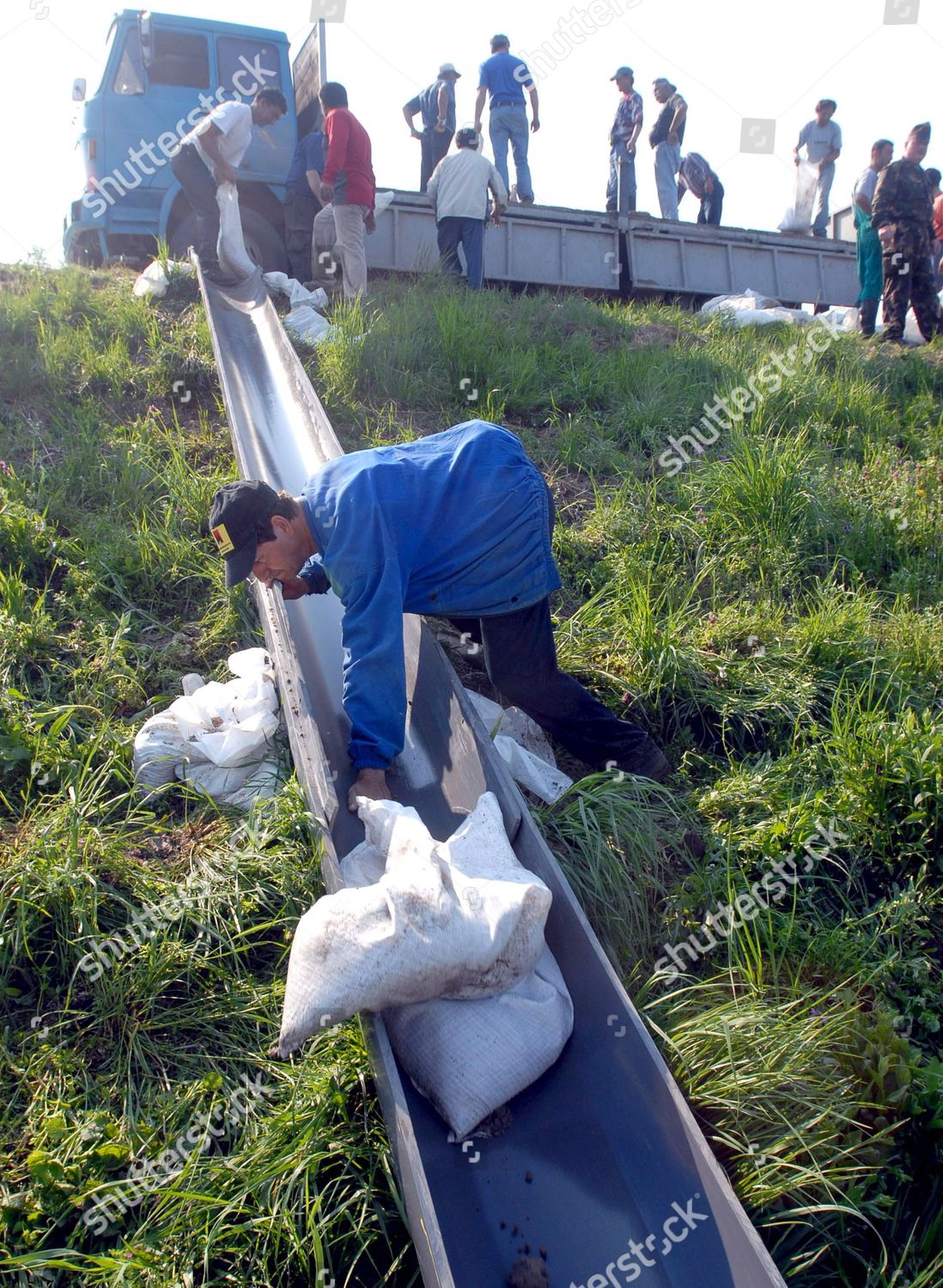 Volunteers Work On Reinforcing Dam River Editorial Stock Photo - Stock ...