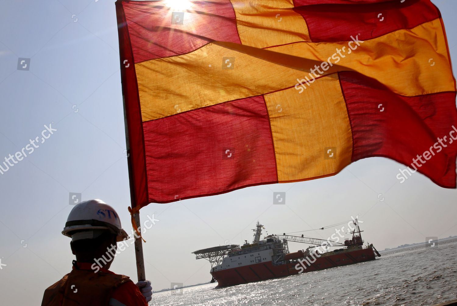 Dock Worker Hoists Flag During Arrival Editorial Stock Photo - Stock ...