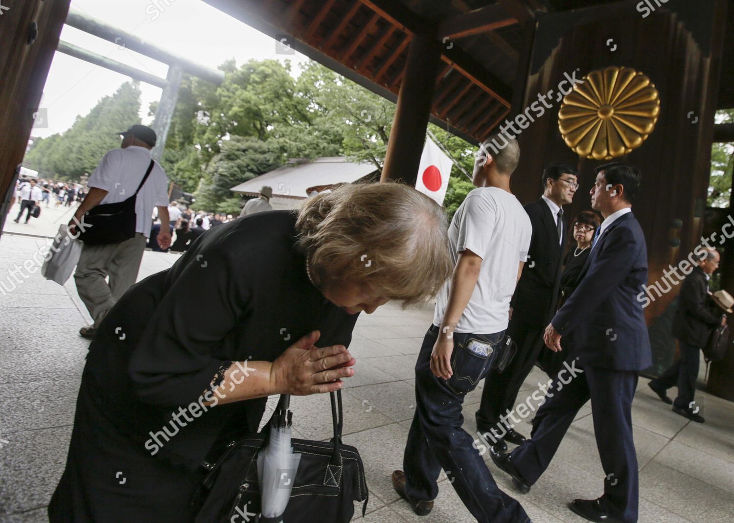 Elderly Woman Bows Deeply Under Chrysanthemum Editorial Stock Photo ...