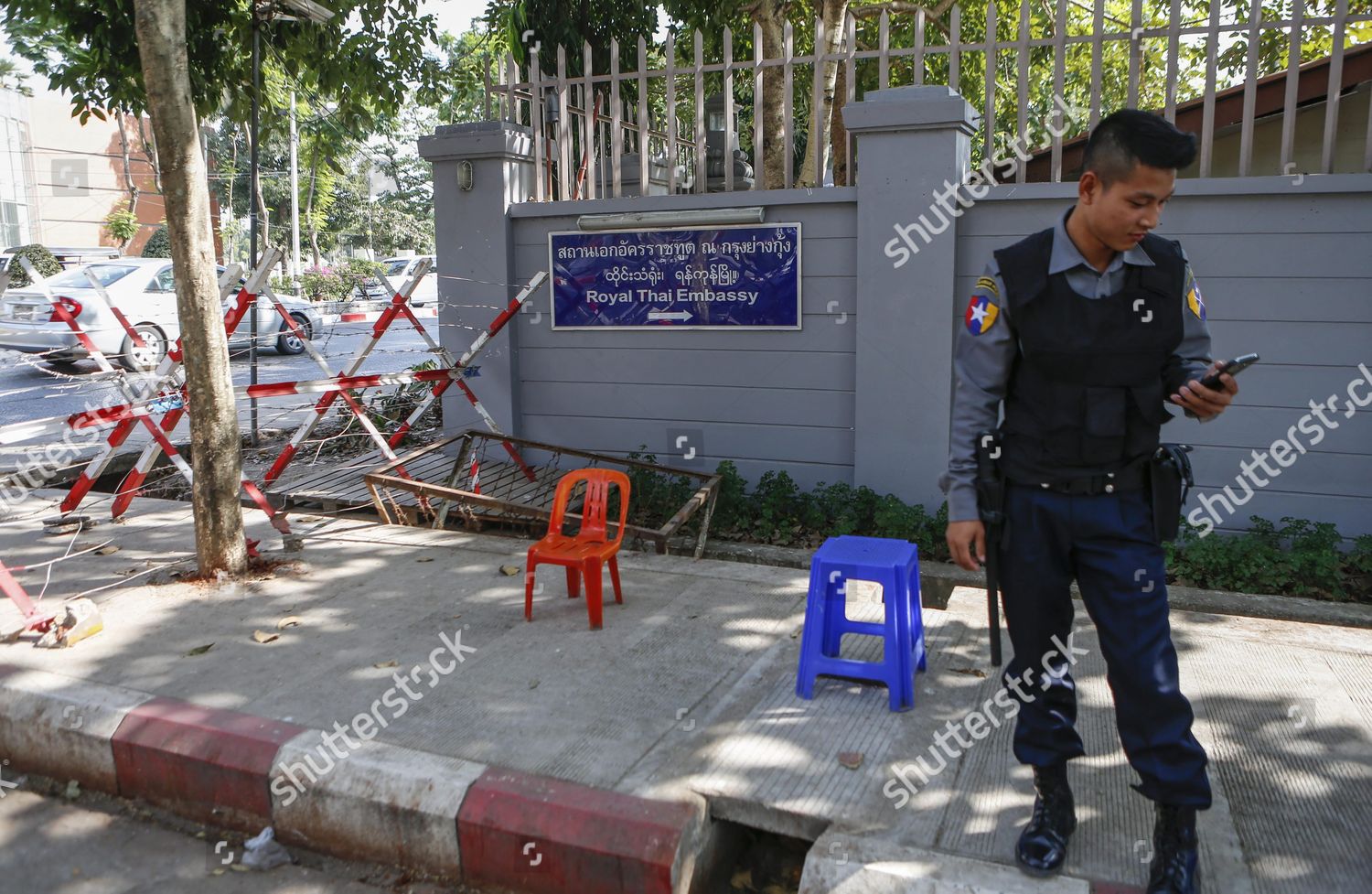MYANMAR POLICEMAN USES MOBILE PHONE NEAR Editorial Stock Photo - Stock ...