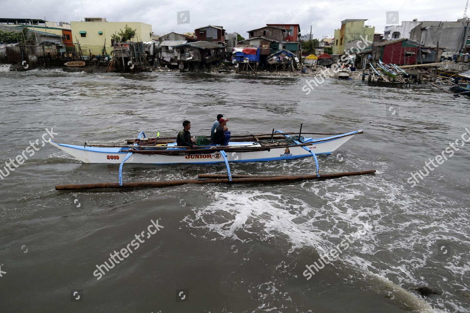 Filipino Fishermen On Boat Paddle Amid Editorial Stock Photo - Stock ...