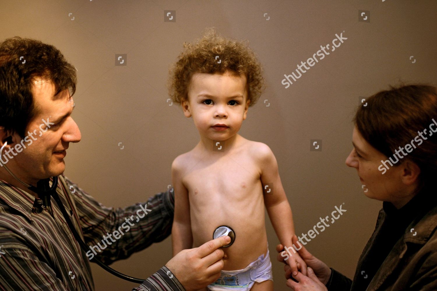Child Examined By Doctor During Pediatric Editorial Stock Photo - Stock ...