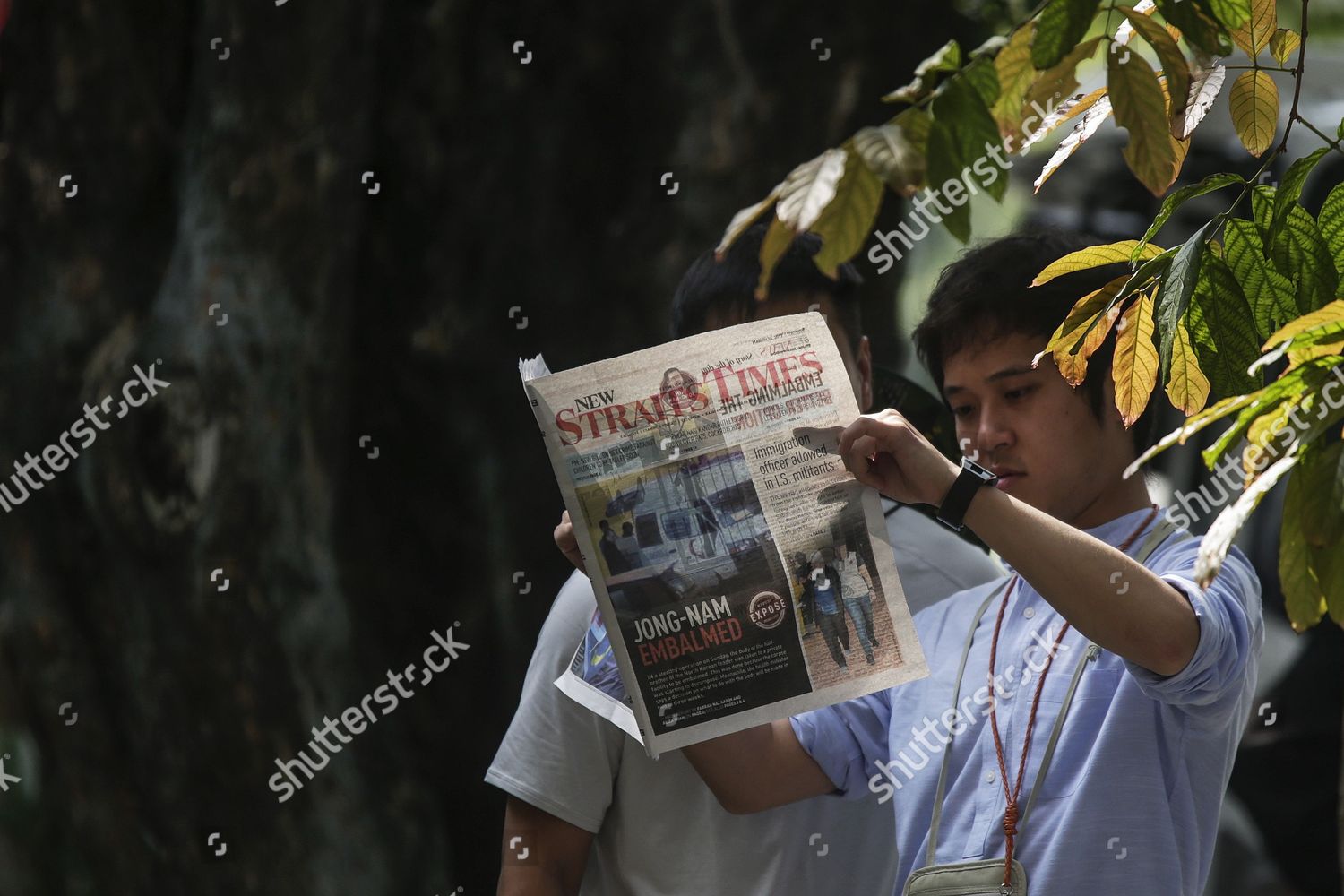Person Reads Local Newspaper Headline Reading Editorial Stock Photo ...