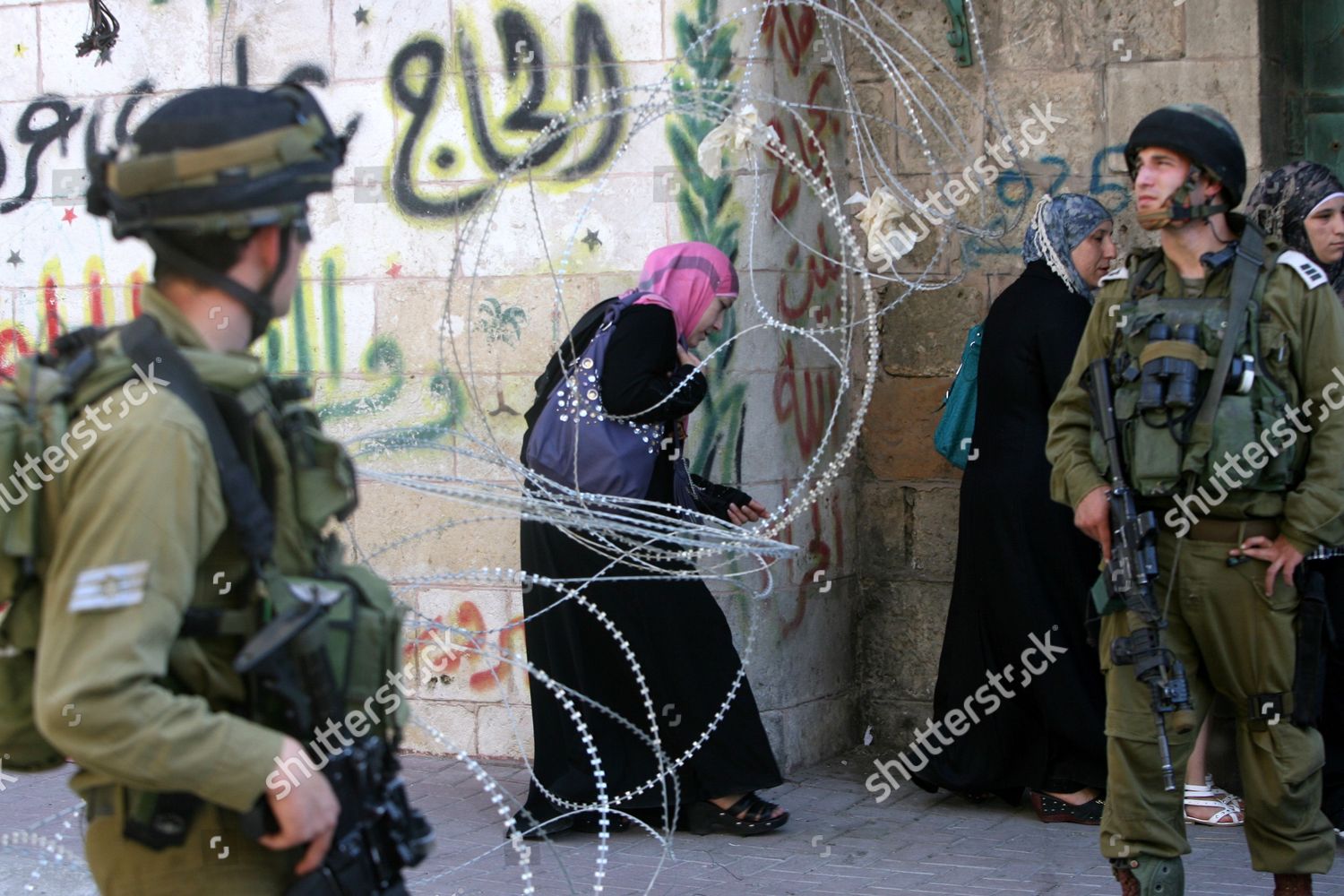 Palestine Woman Ducks Under Barbed Wire Editorial Stock Photo - Stock ...