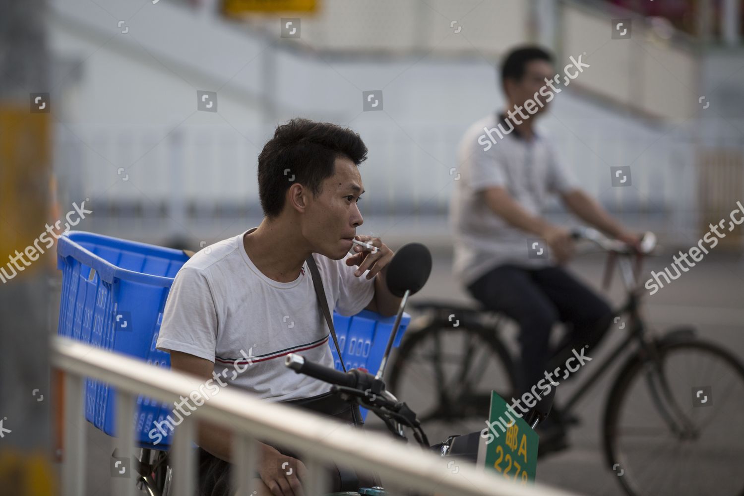 Man On Bicycle Smokes Cigarette Traffic Editorial Stock Photo - Stock ...