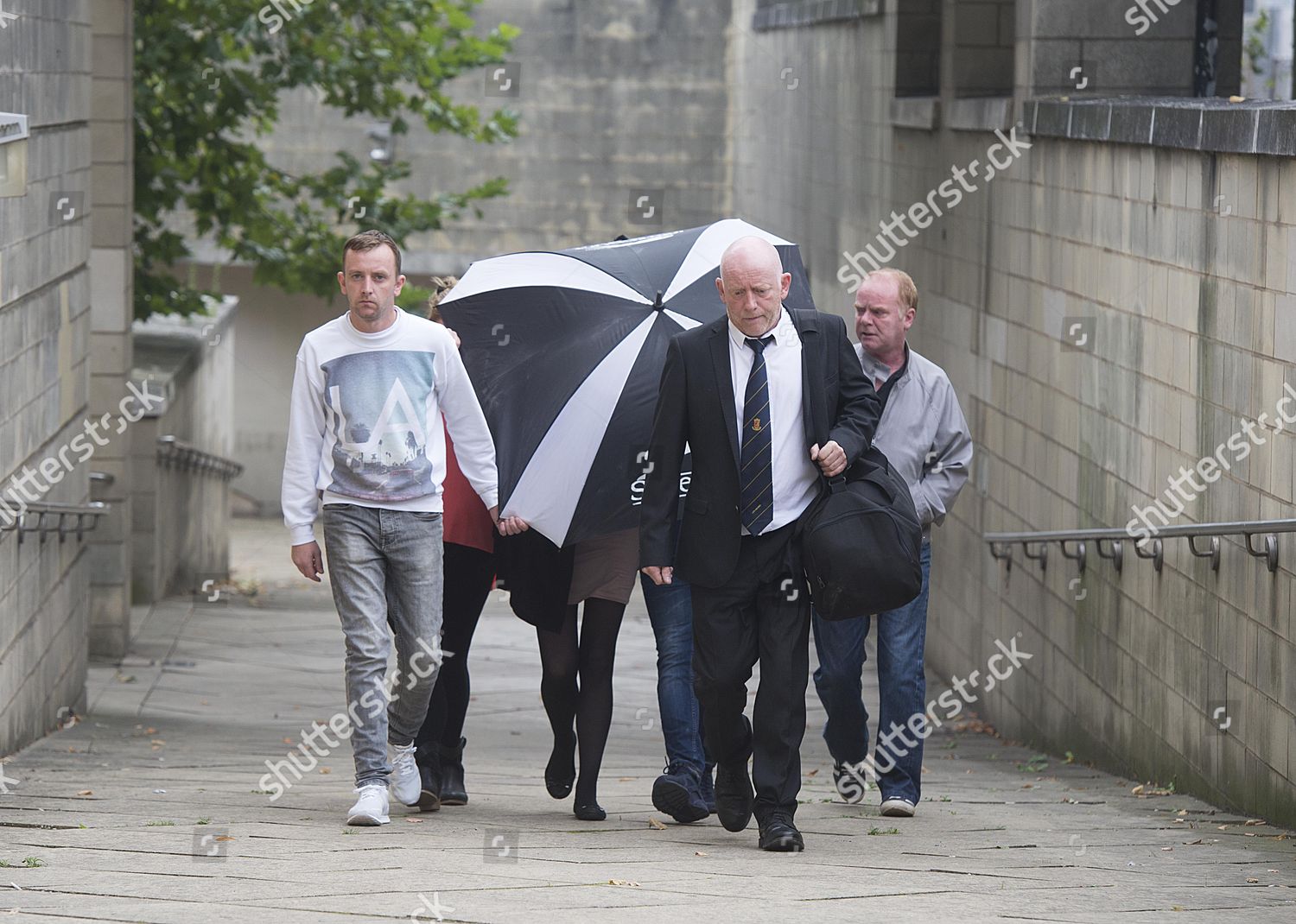 Claire Riley Arriving Covered By Umbrellas Editorial Stock Photo ...