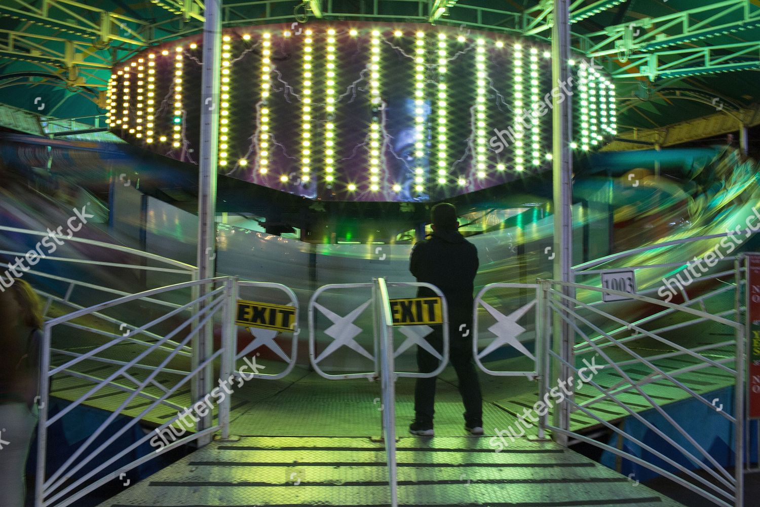 RIDE OPERATOR KEEPS WATCH OVER SPINNING Editorial Stock Photo - Stock ...