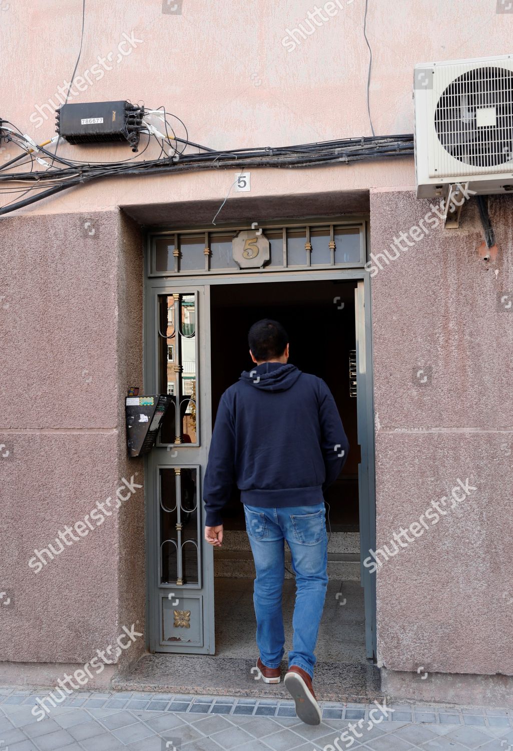Man Enters Residential Building Where Spanish Editorial Stock Photo ...