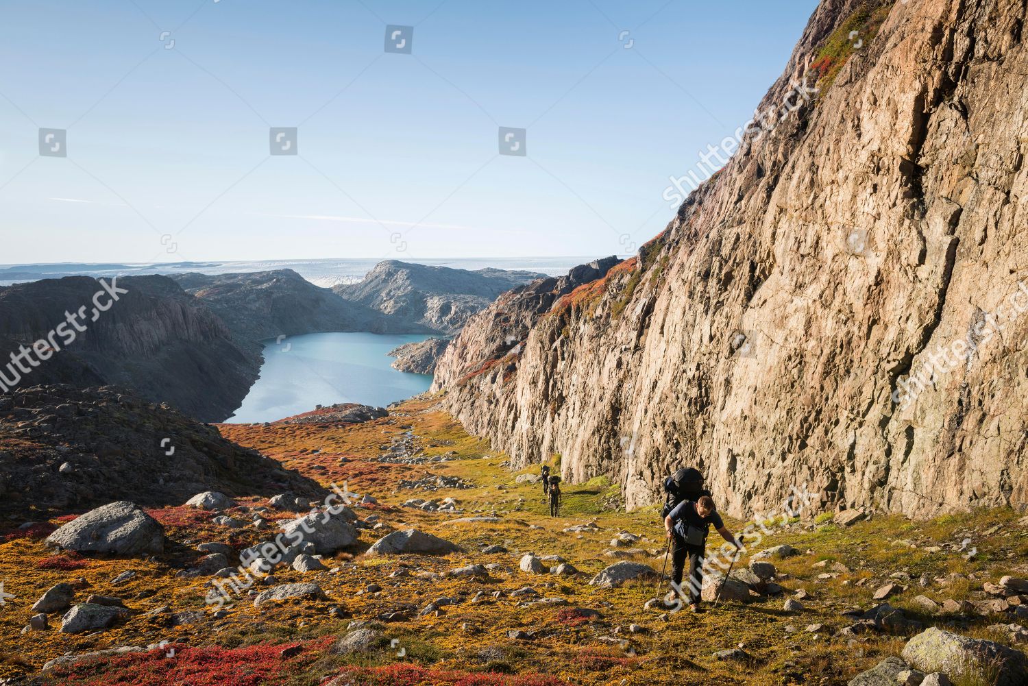 Trekking Group Runs Along Rock Face Editorial Stock Photo - Stock Image ...