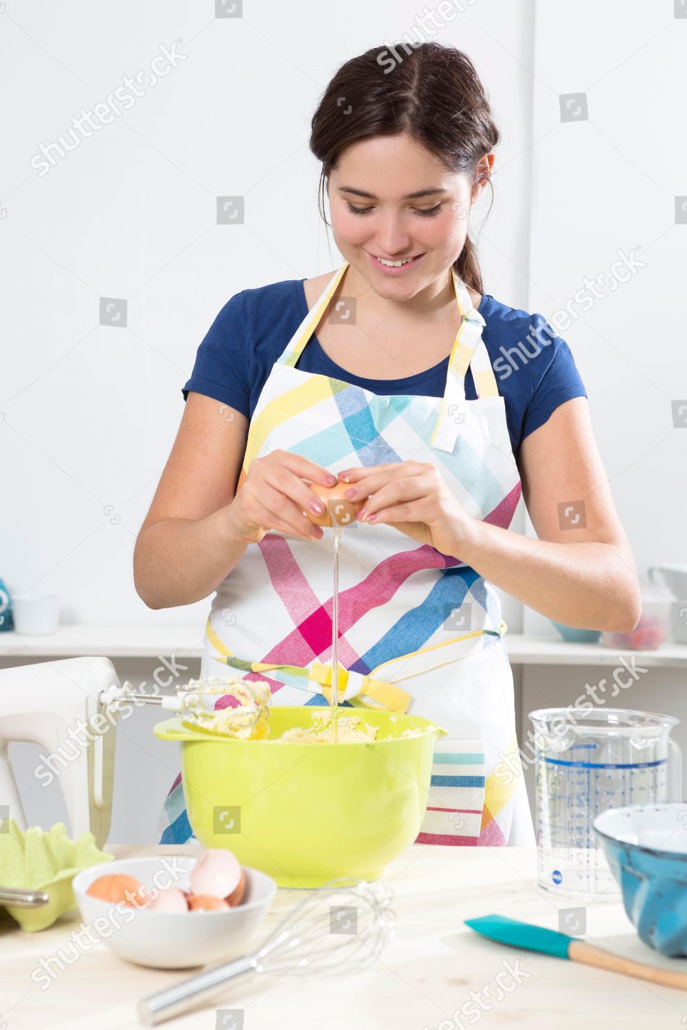 Model Released Young Woman Baking Cake Editorial Stock Photo - Stock ...