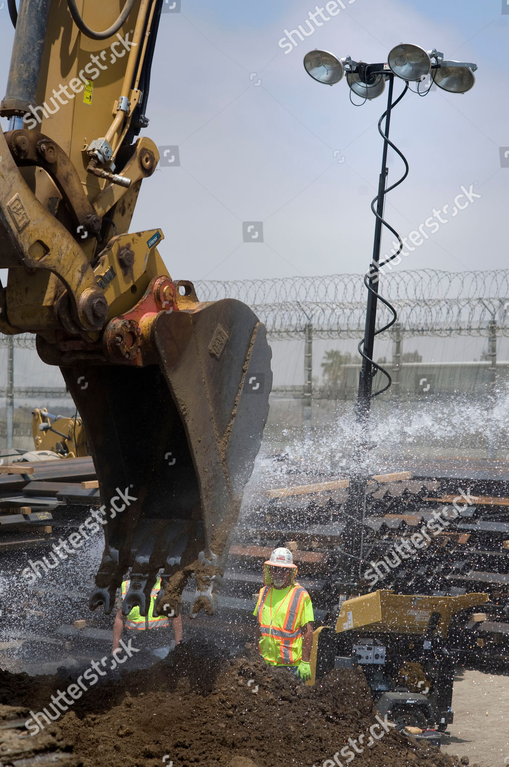 Worker Watches Water Sprayed On Dirt Editorial Stock Photo - Stock ...