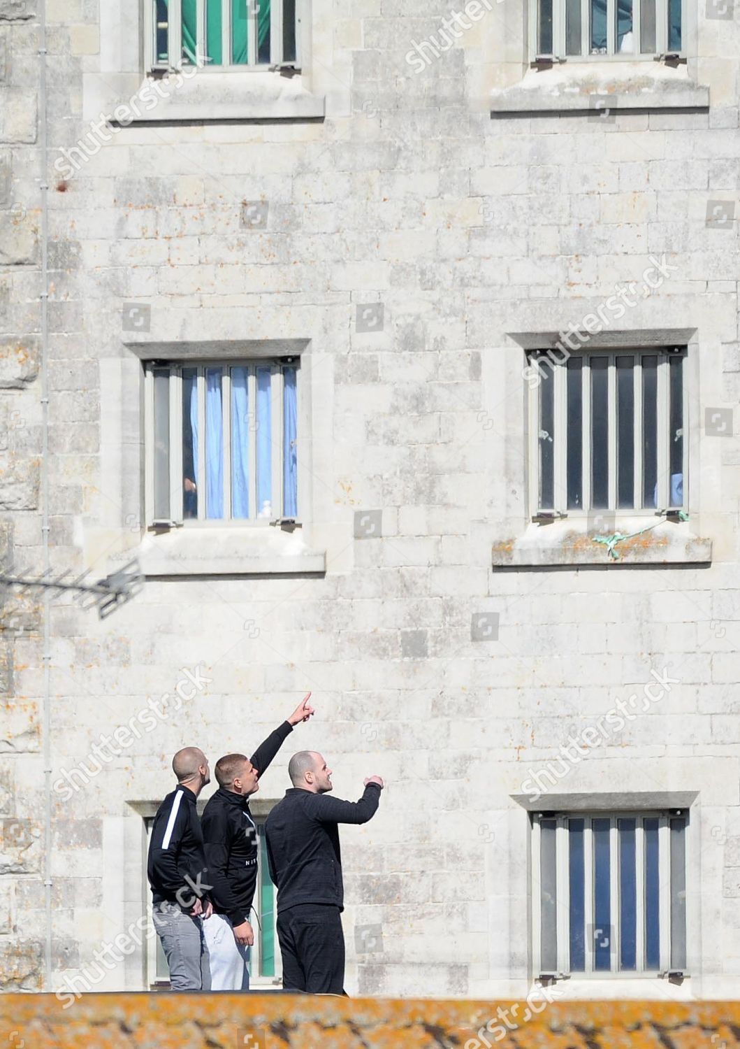 Three Prisoners Protest On Rooftop Hm Editorial Stock Photo - Stock ...