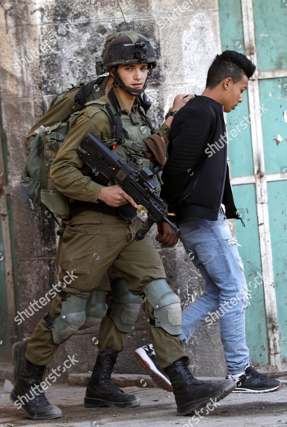 Israeli Army Soldiers Arrest Palestinian Following Editorial Stock ...